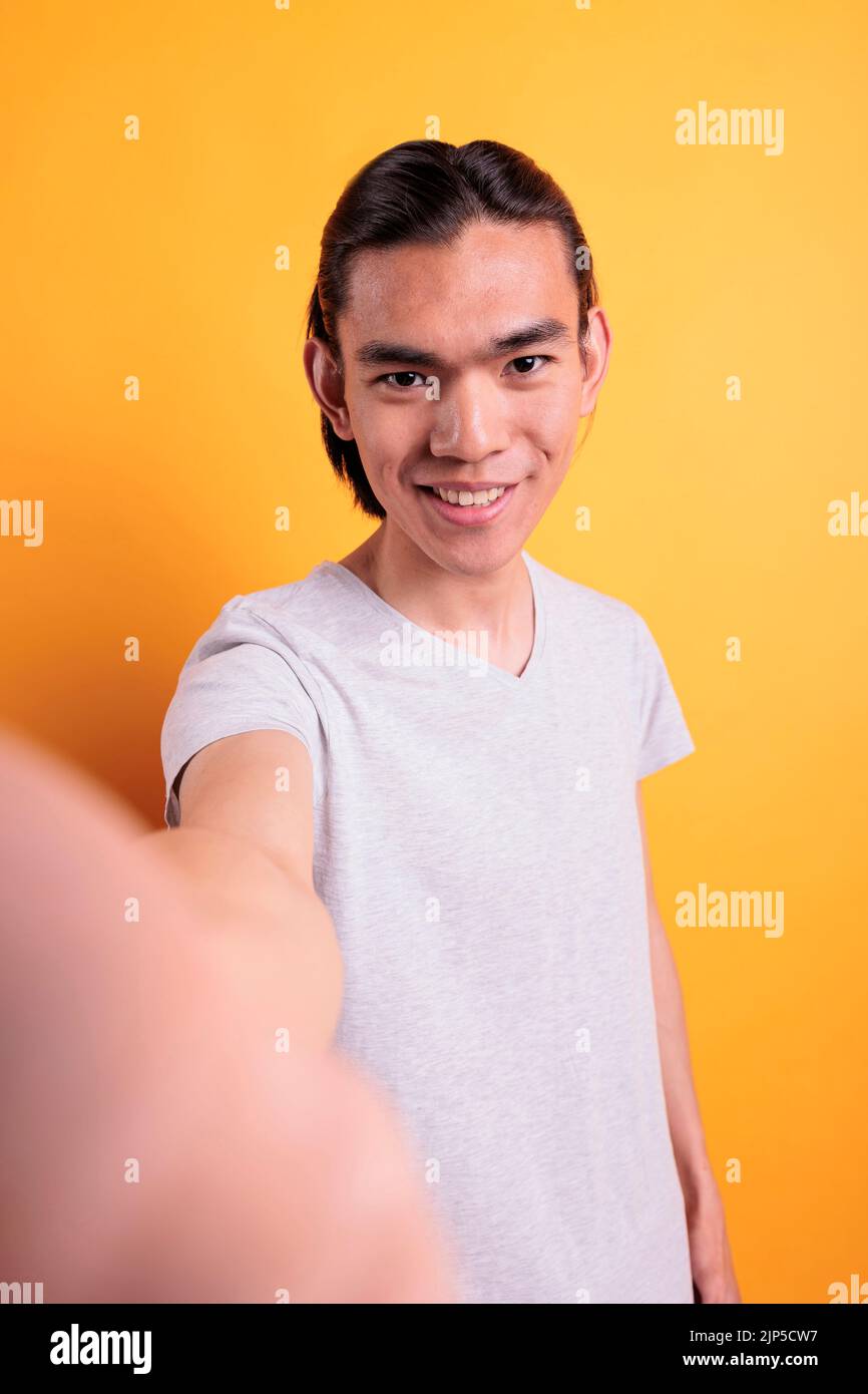 Hand holding smartphone to take video hi-res stock photography and ...