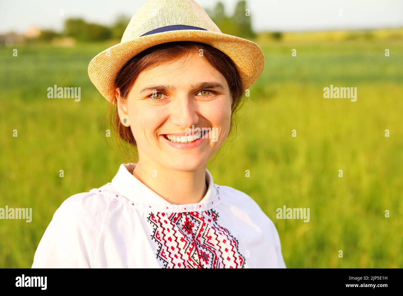 Defocus young ukrainian woman portrait. Meadow nature background. Young ... Defocus young ukrainian woman portrait. Meadow nature background. Young ...