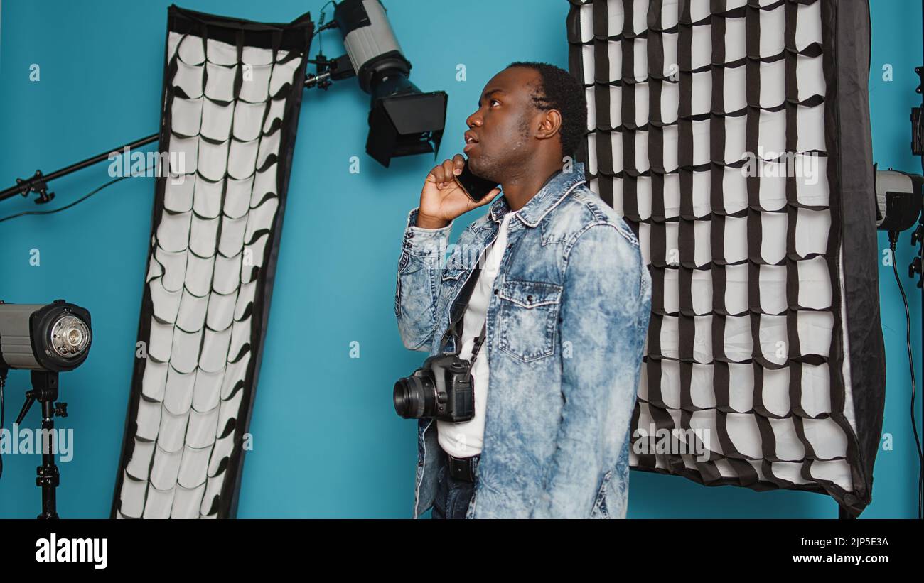 African american model talking on smartphone call over background with ...