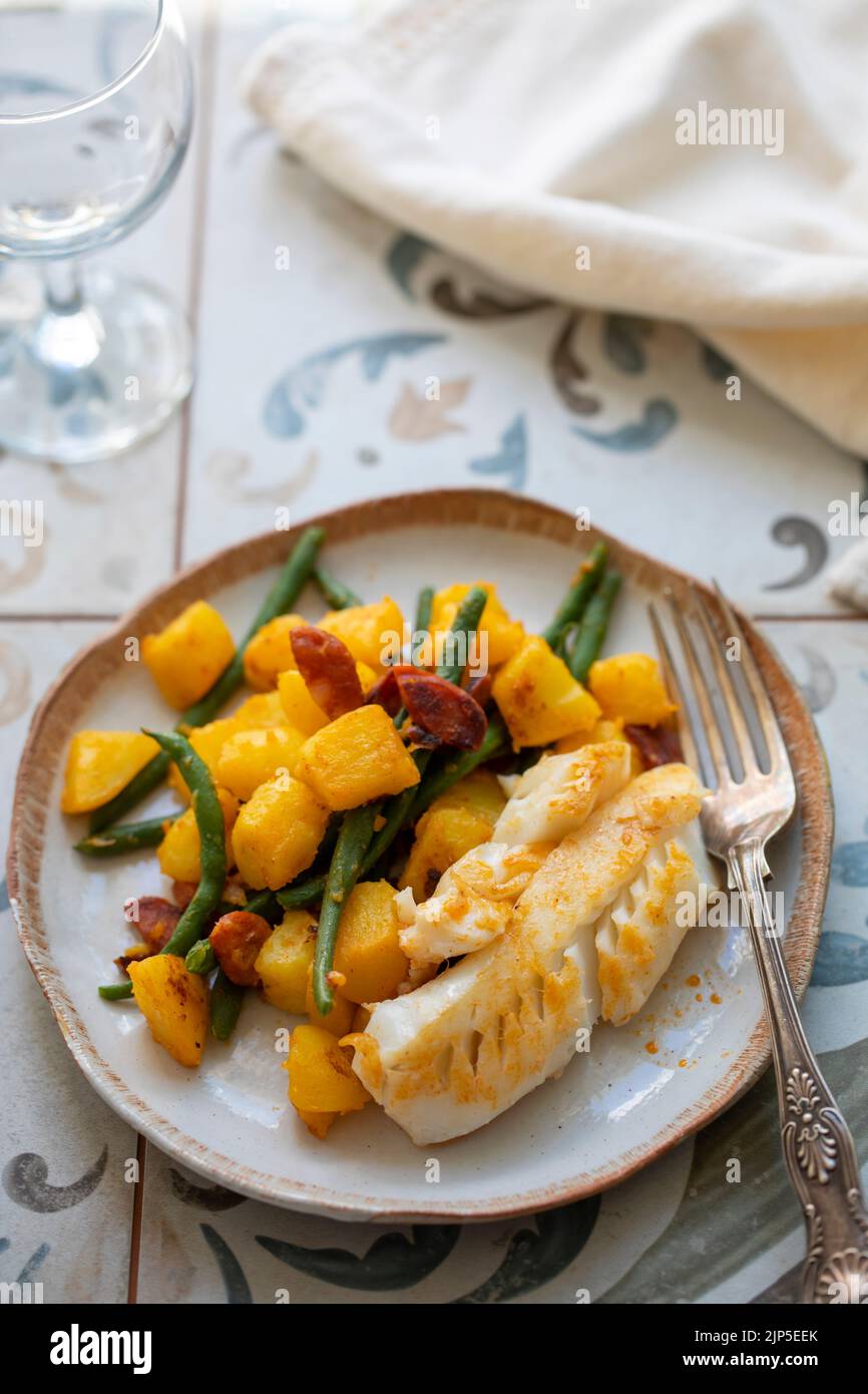 Spanish dish of cod with potato and chorizo Stock Photo - Alamy