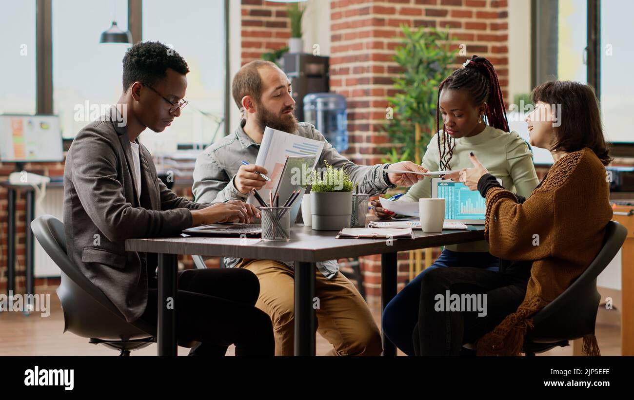 Multiethnic team of people working on business collaboration ...