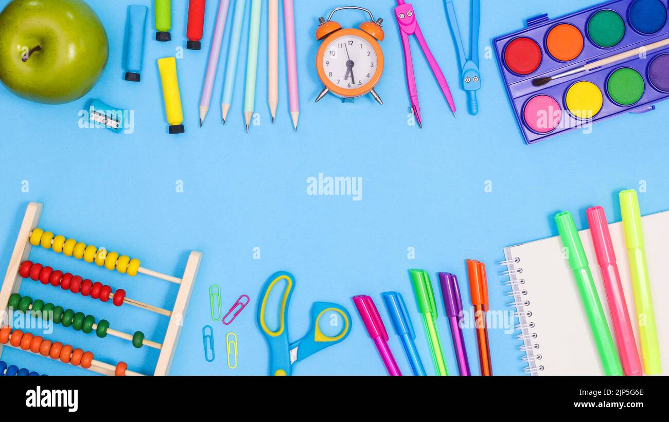 Back to school copy space on pastel blue background with school ...