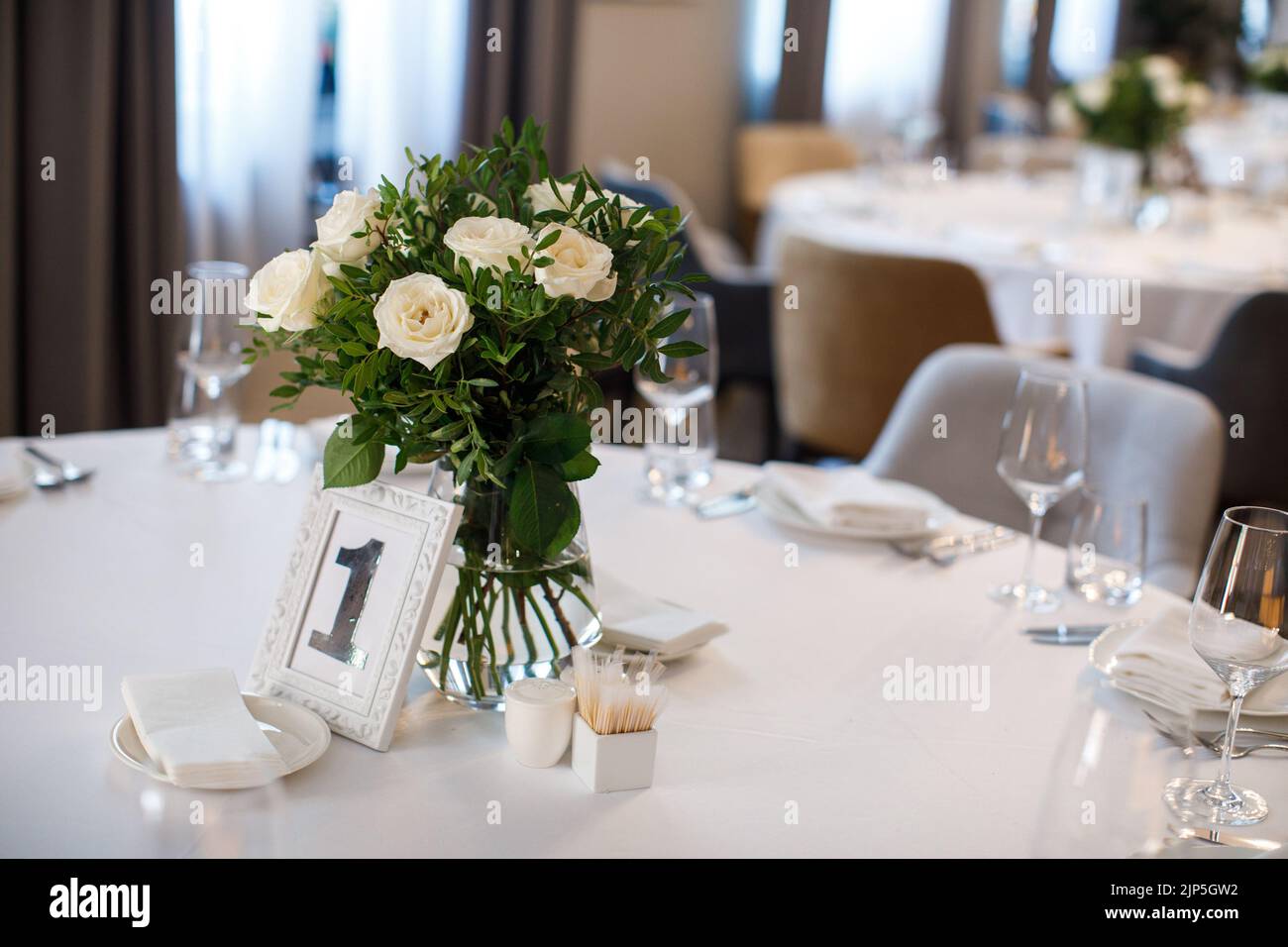 Bouquet of flowers in vase on the wedding table Stock Photo - Alamy