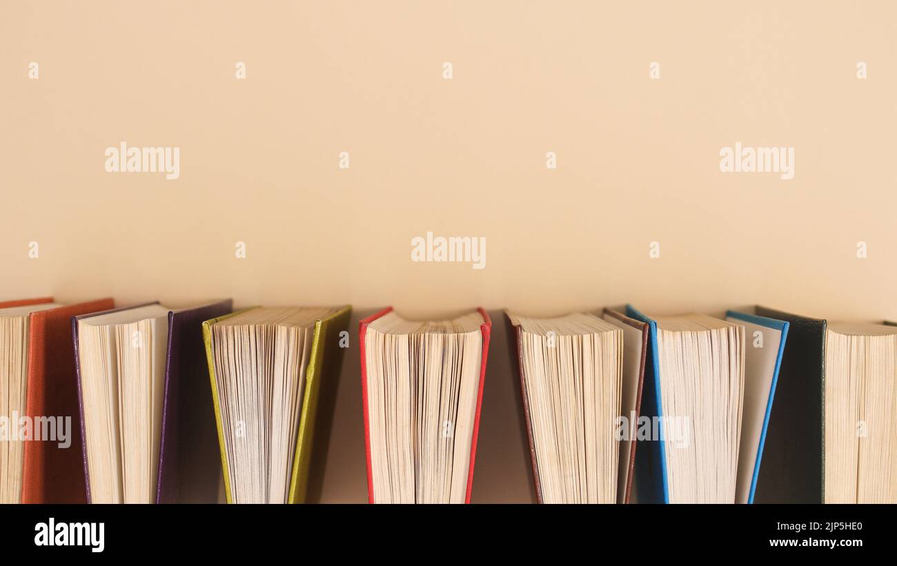 Vintage books onbeige background with copy space. Flat lay Stock Photo ...