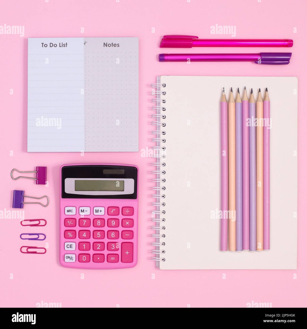 Pastel pink background with pink school supplies. Creative layout back ...