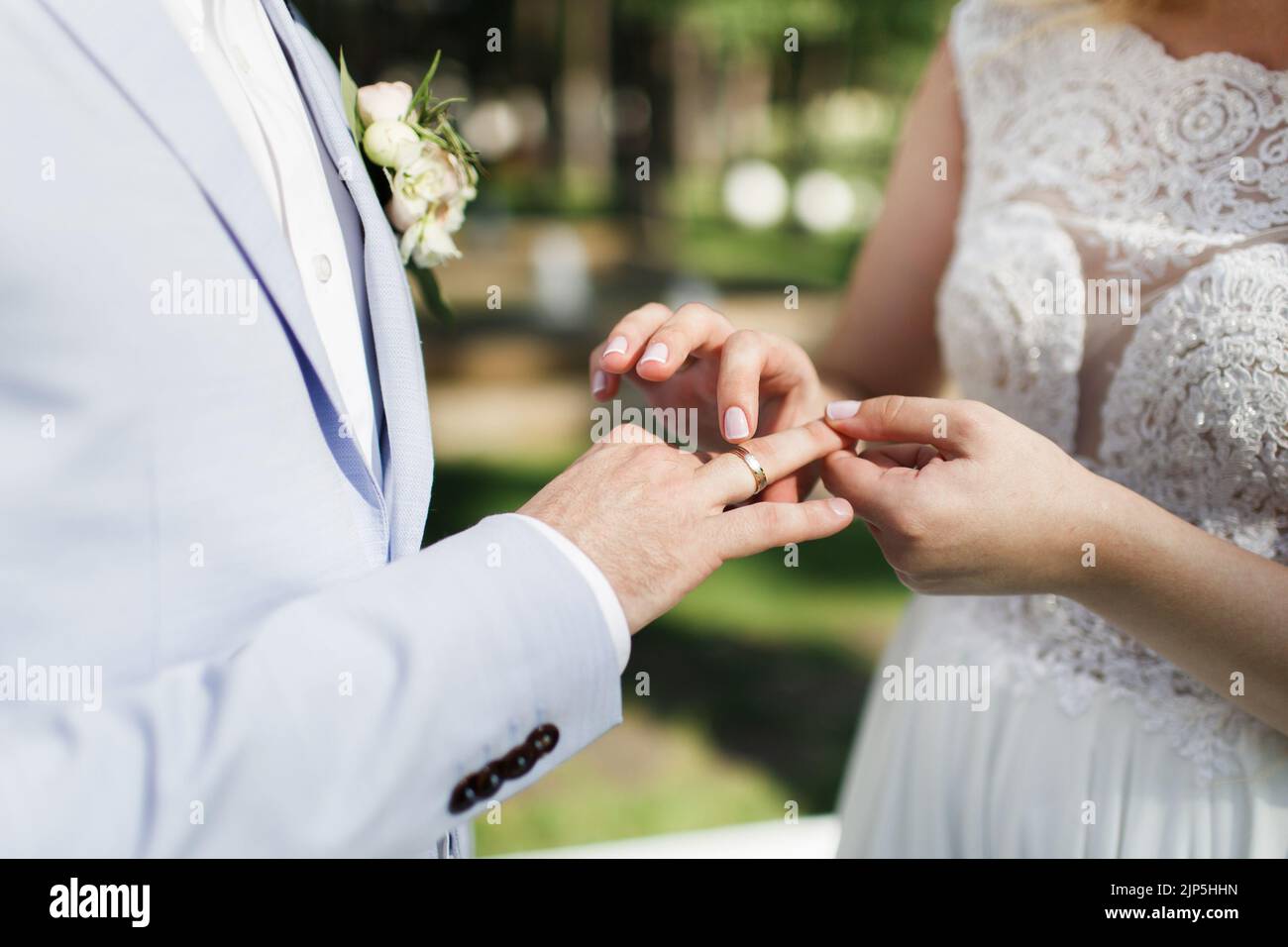 Bride and groom exchange rings at the wedding ceremony Stock Photo - Alamy