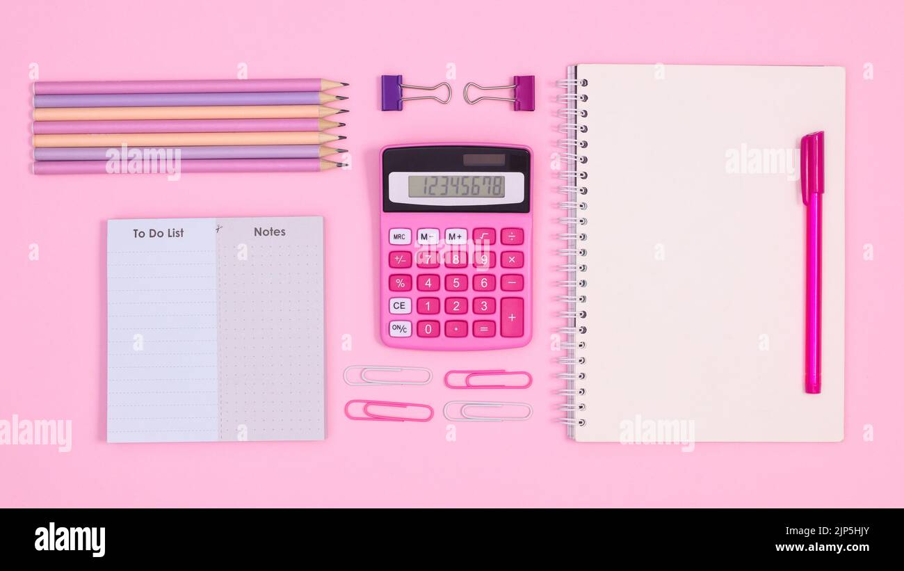 Pastel pink background with pink school supplies arrangement. Creative ...