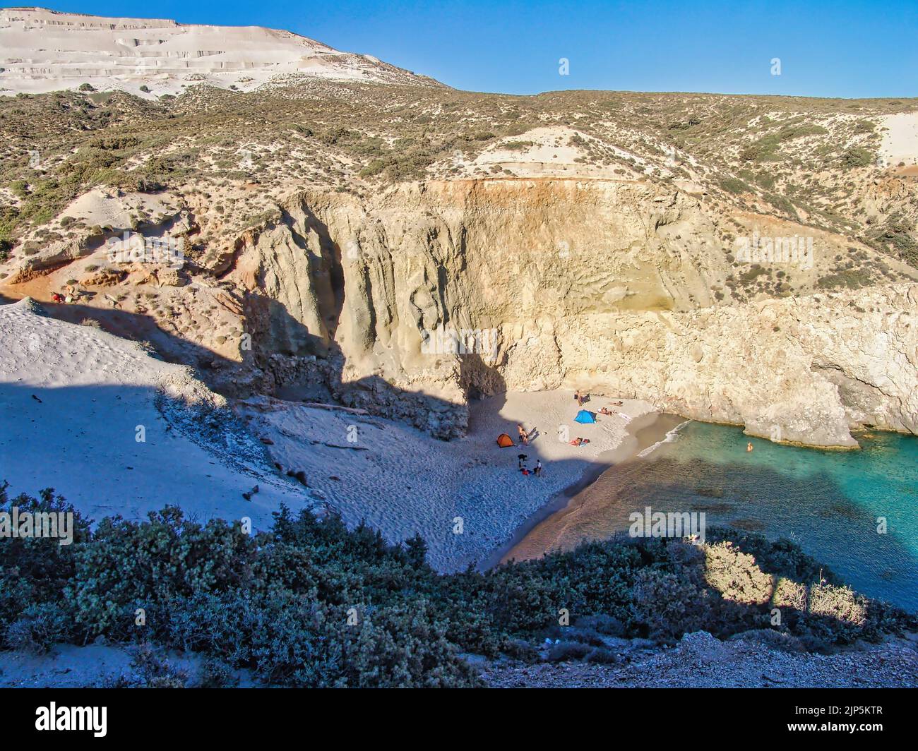 A mesmerizing view of sunny Tsigrado Beach in Milos Island, Greece ...