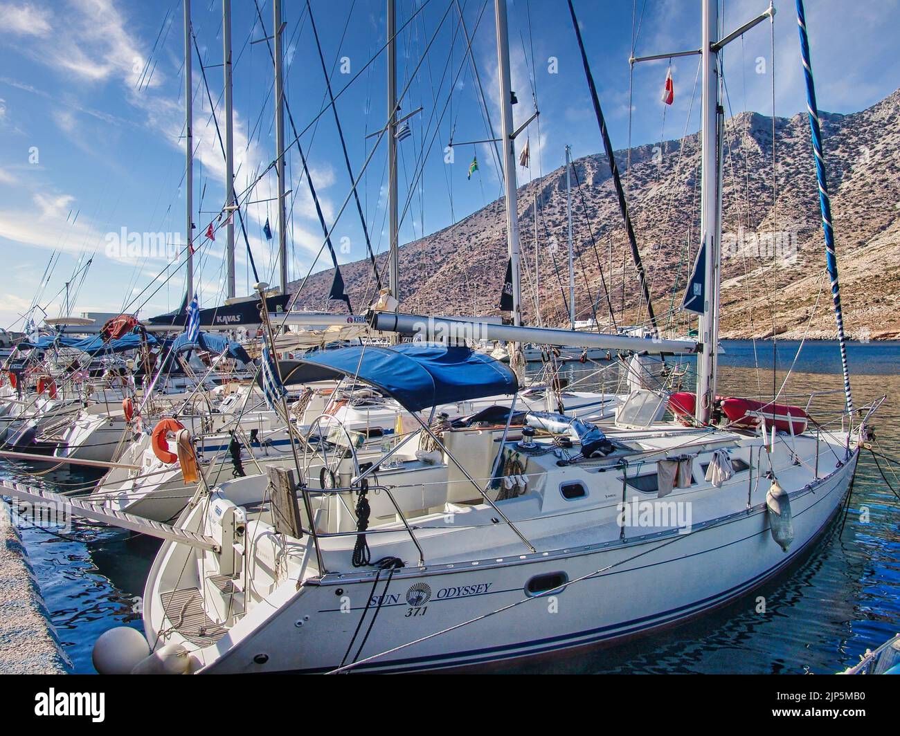 A beautiful shot of boats in the water docked on a port near Kamares ...