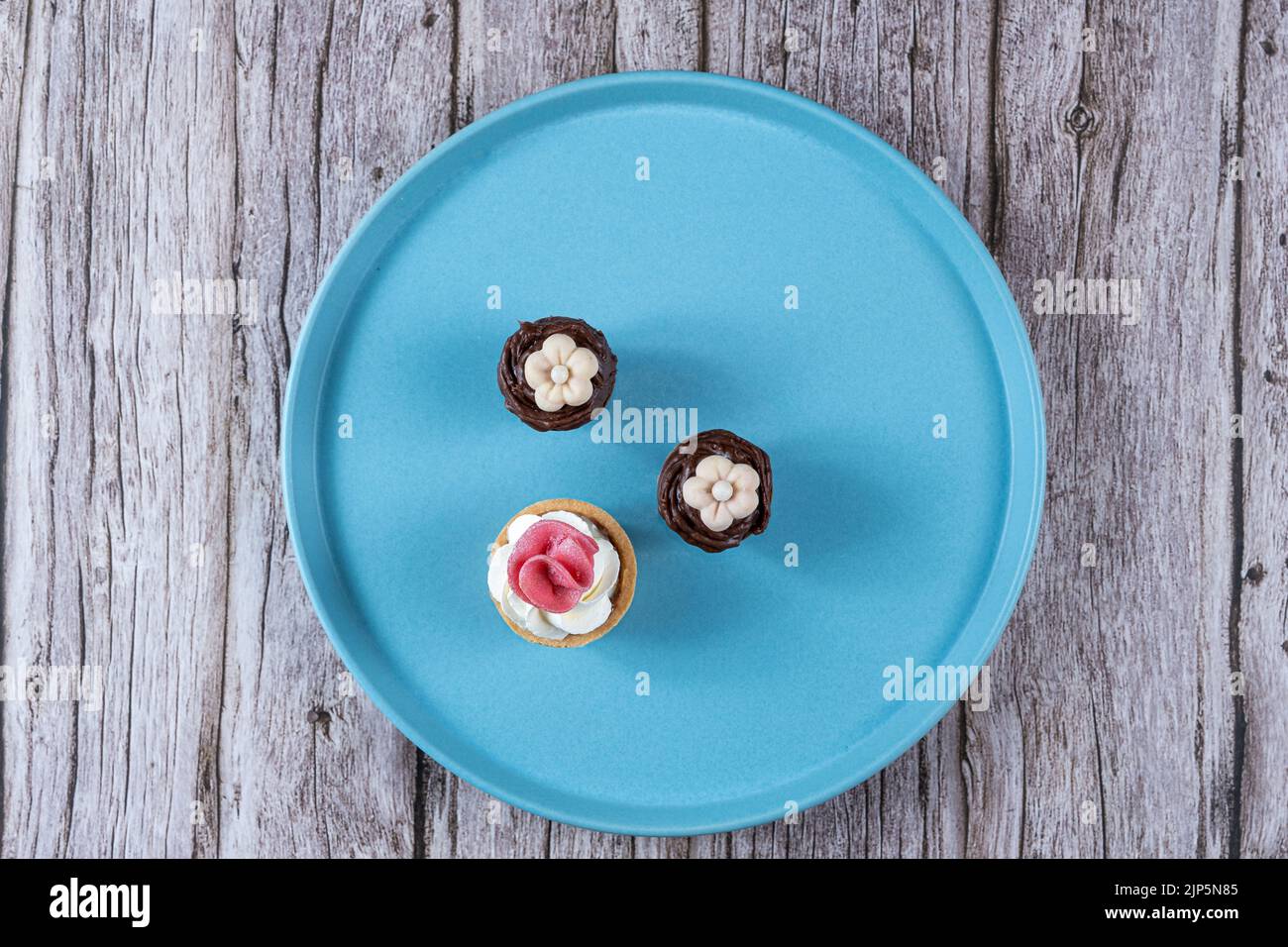 Small sophisticated sweets filled with chocolate ganache and topped ...