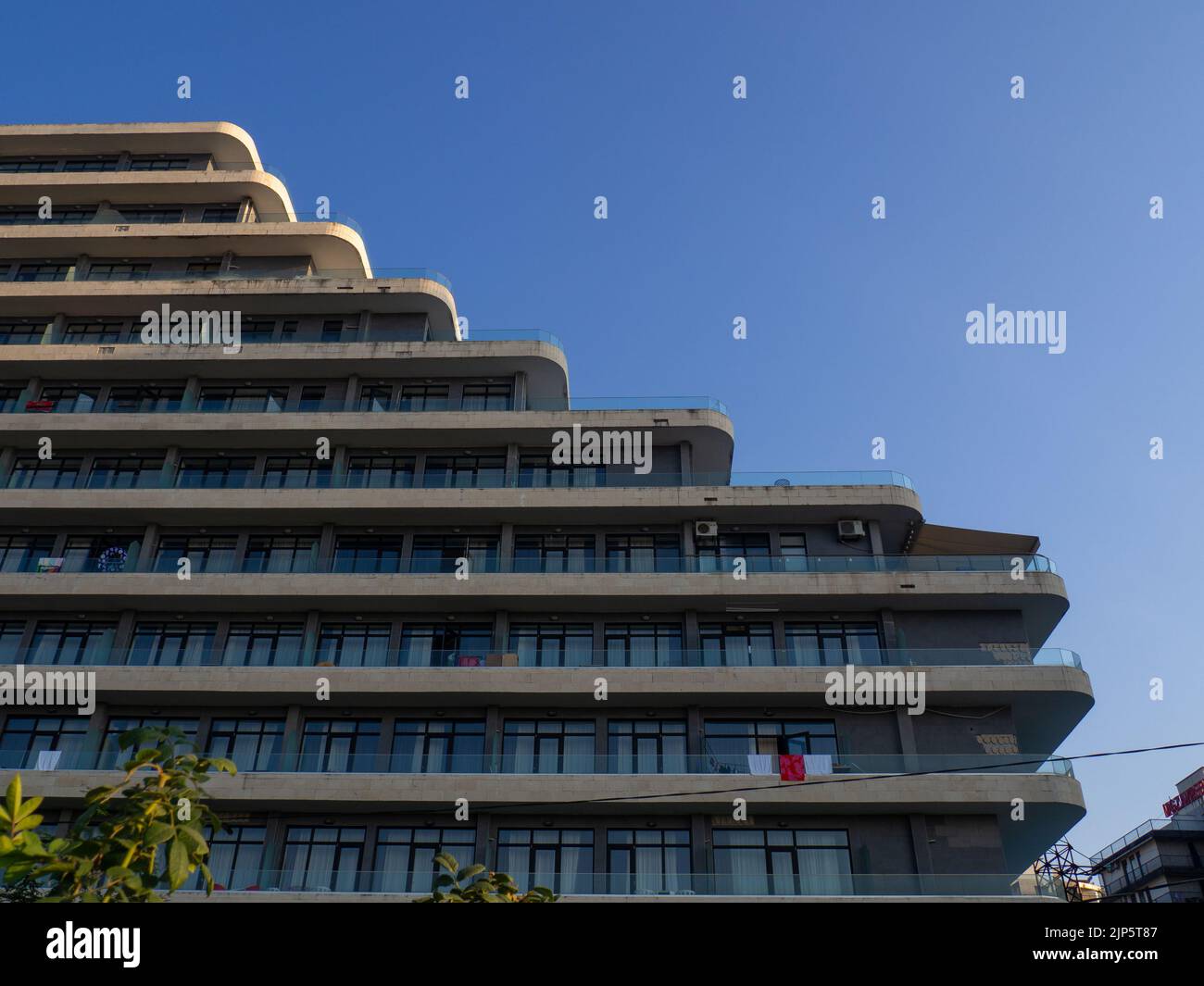 An old ladder-shaped hotel. Multi-tiered hotel building. Resort place ...