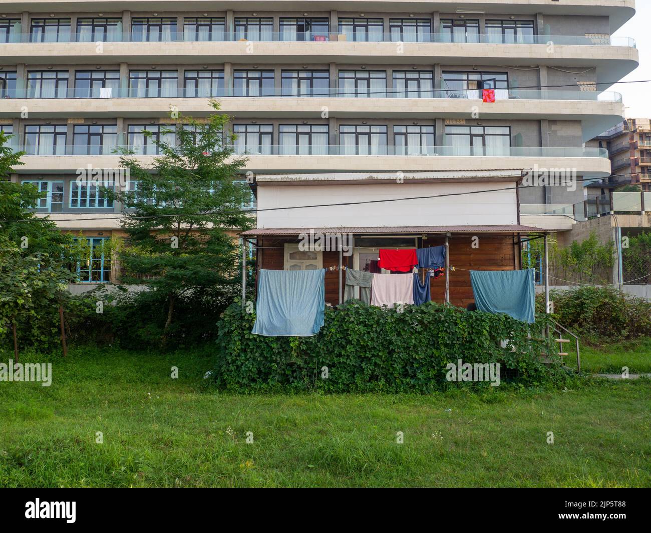 Multi-tiered hotel building and the private sector. Rented housing ...