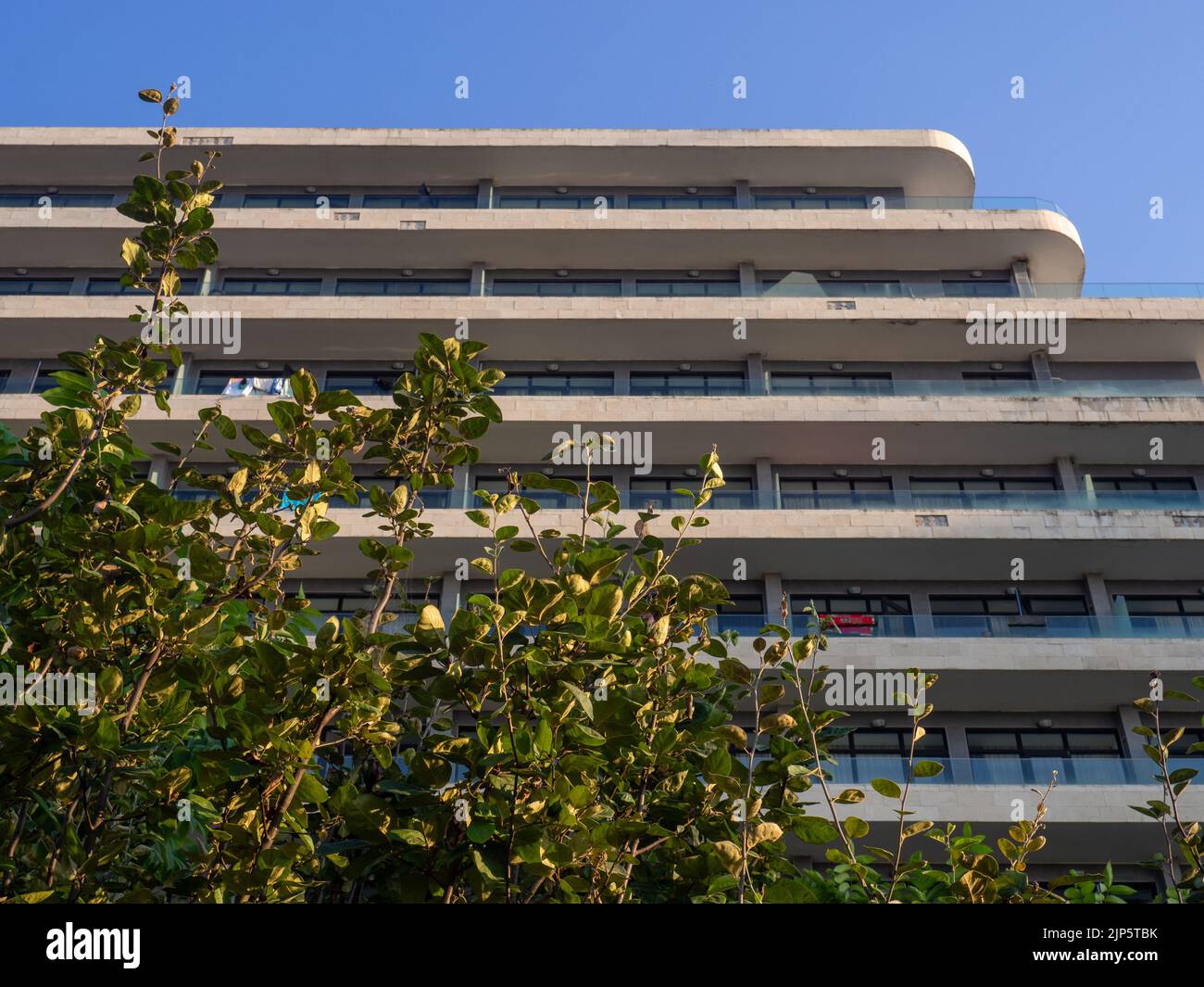 An old ladder-shaped hotel. Multi-tiered hotel building. Resort place ...