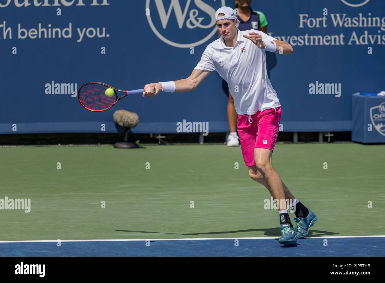 Mason, Ohio, USA. 15th Aug, 2022. John Isner (USA) hits a forehand shot ...