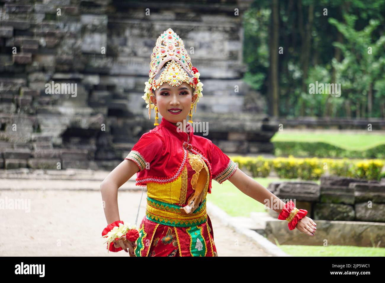 Indonesian dancer with the traditional costume is ready to perform to ...