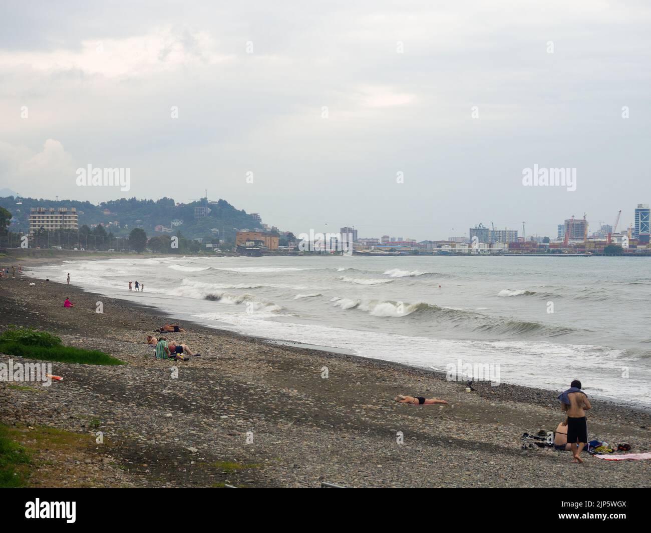 People on the beach but not swimming. on the beach in bad weather ...
