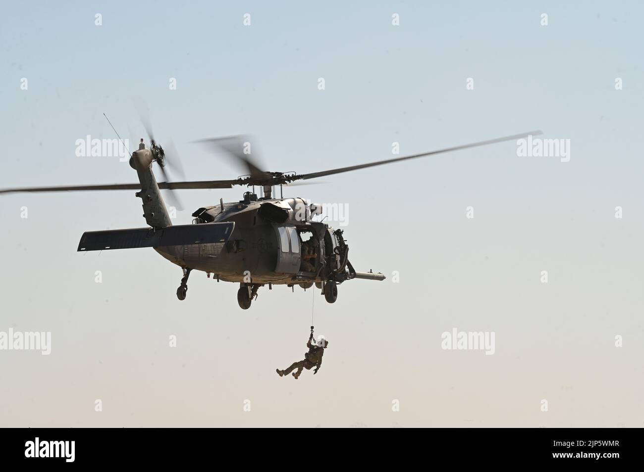 A U.S. Air Force pararescueman, assigned to the 52nd Expeditionary Rescue Squadron, is hoisted ...