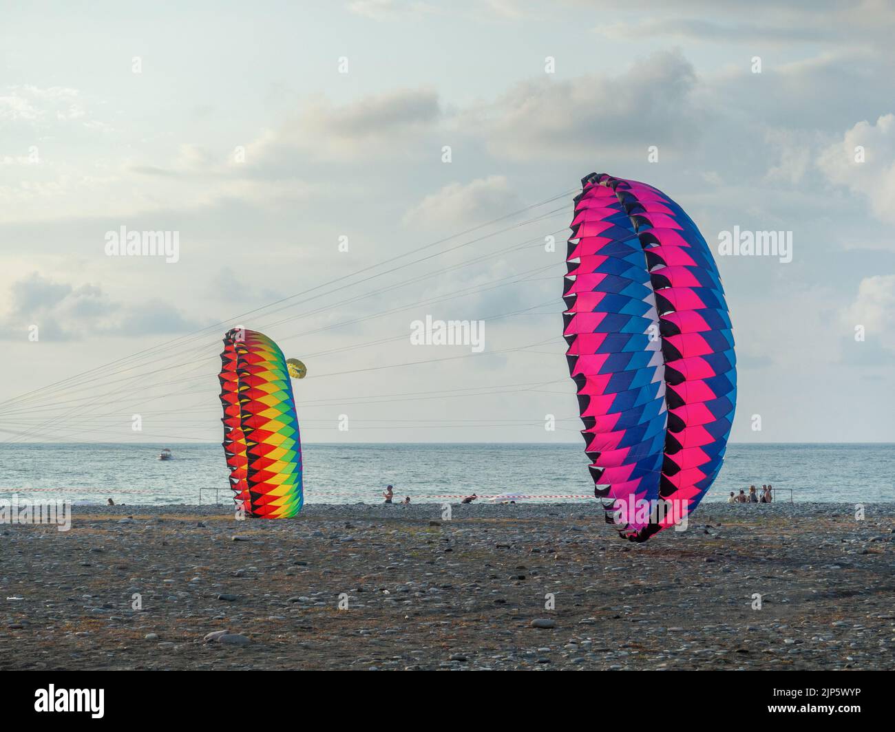 Parachutes on the ground. Wind. Kite Festival. People fly kites ...