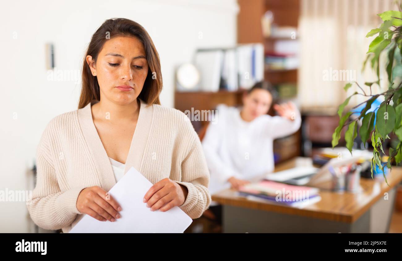 Portrait of upset woman holding dismissal letter Stock Photo - Alamy