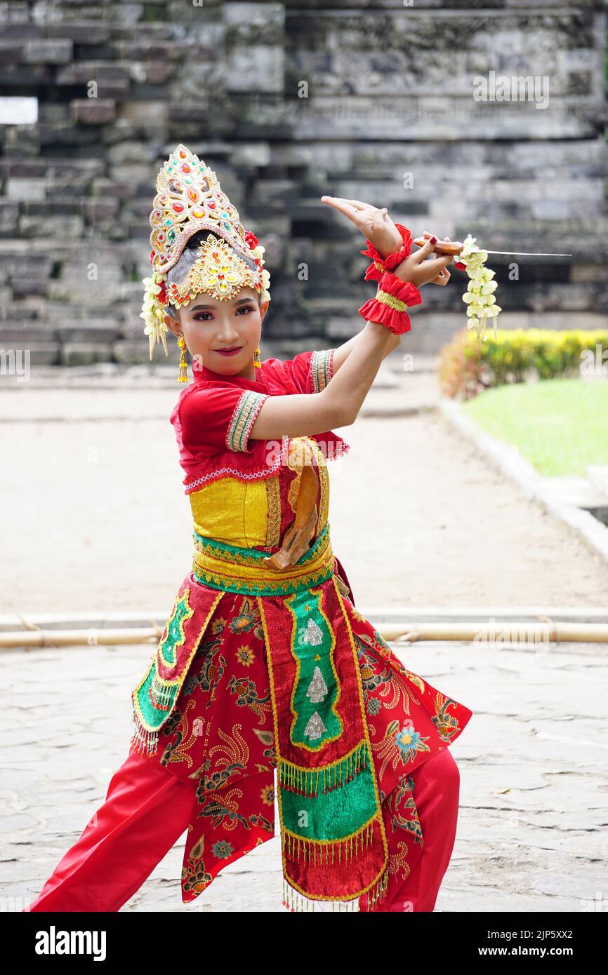Indonesian dancer with the traditional costume is ready to perform to ...