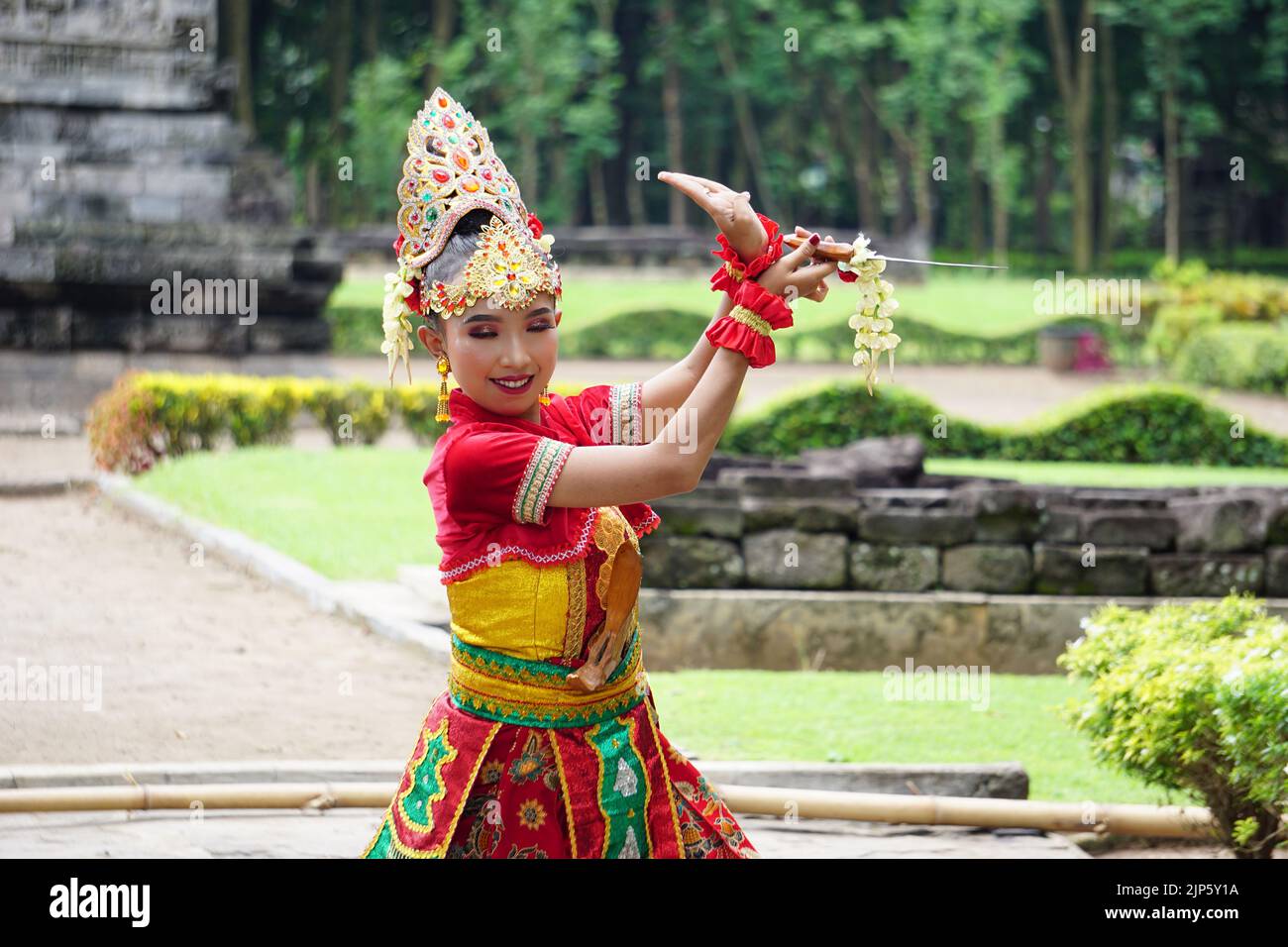Indonesian dancer with the traditional costume is ready to perform to ...