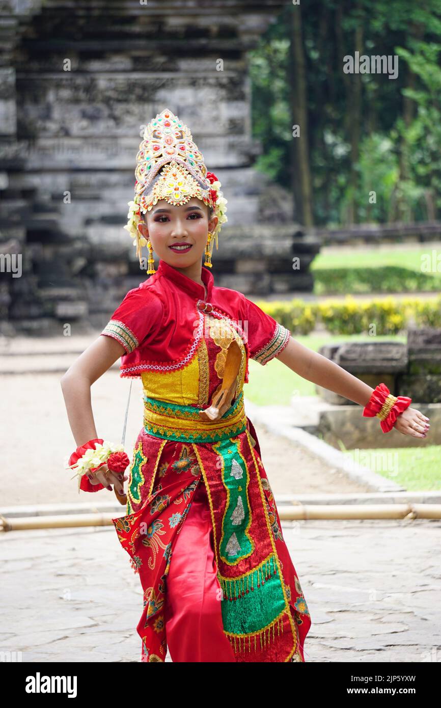 Indonesian dancer with the traditional costume is ready to perform to ...