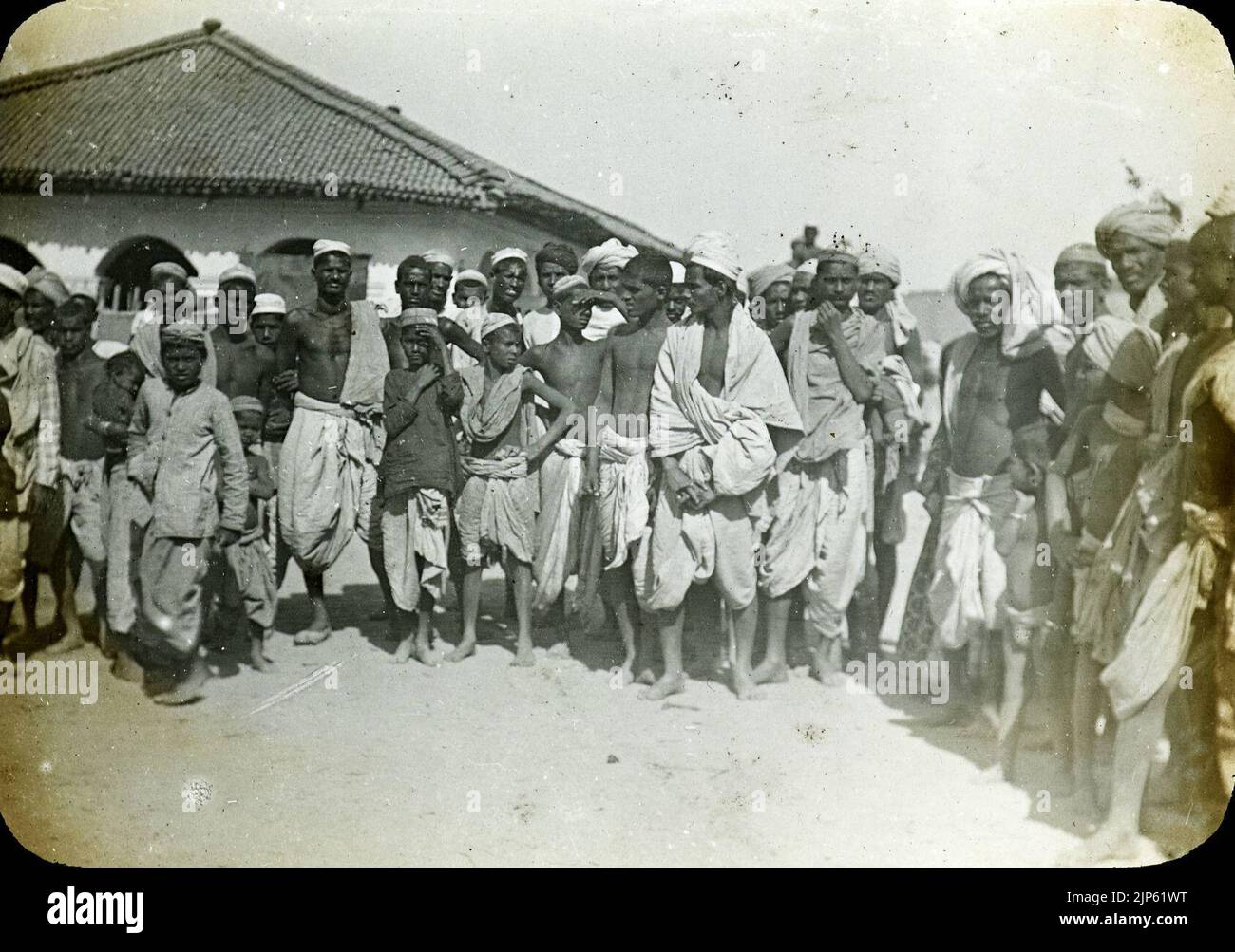 The men wear traditional dress, with caps or turbans on their heads ...