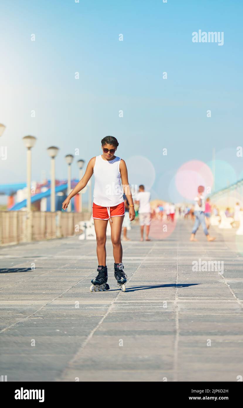 Rollerblading is a great way to stay fit. an attractive young woman ...