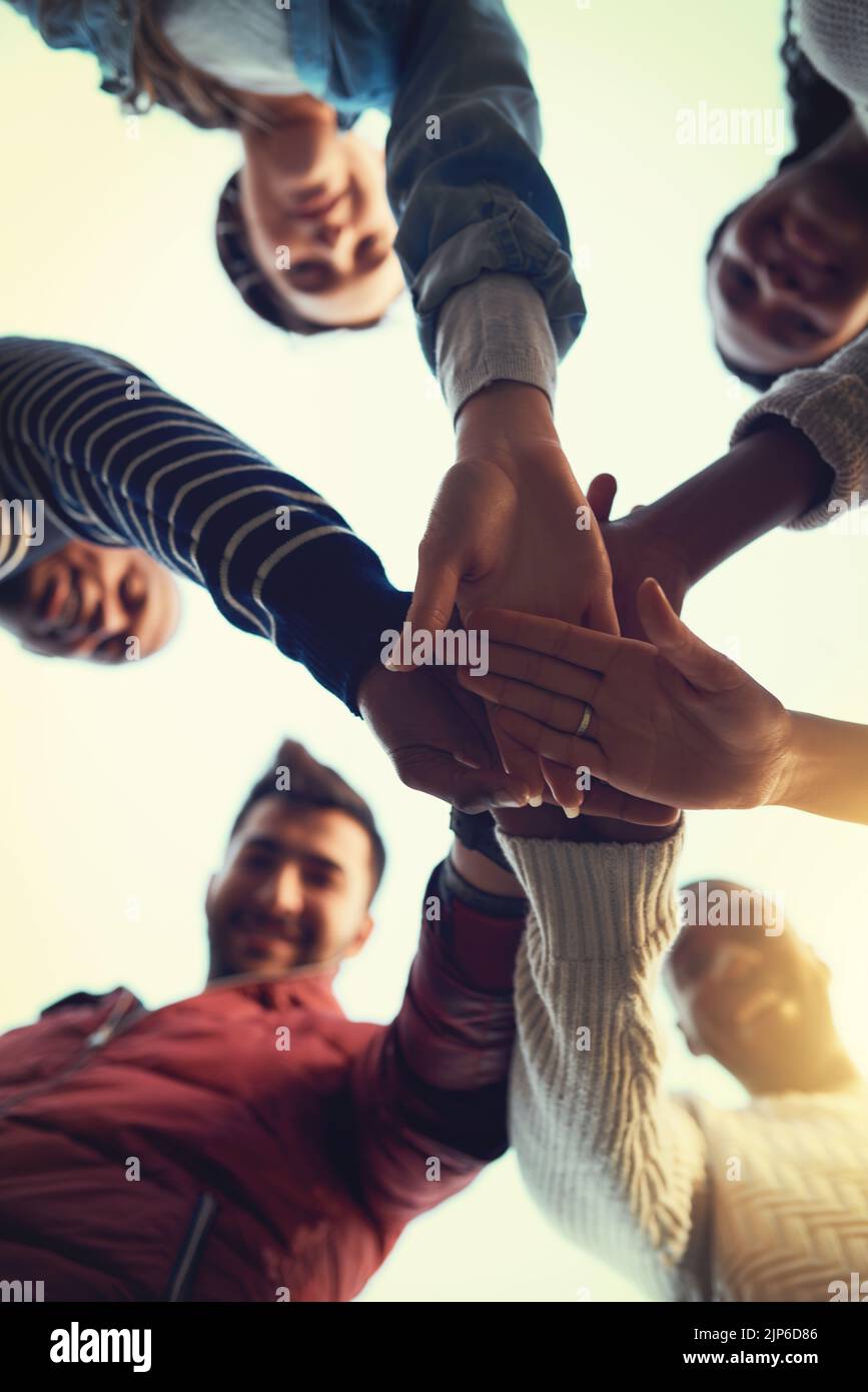 The strongest friendships have the tightest connections. Low angle shot ...