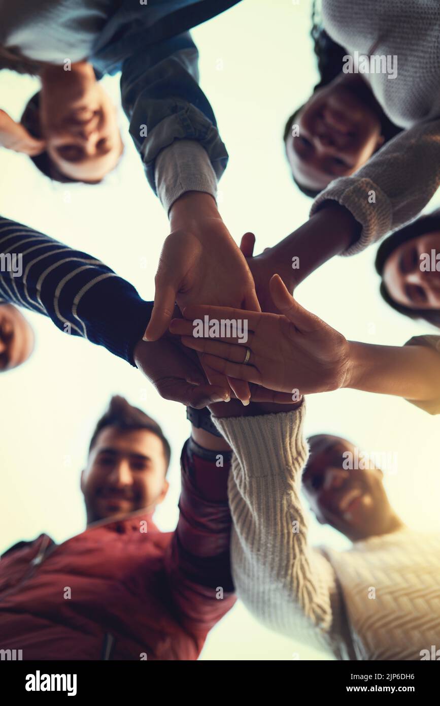 The bond we share can never be broken. Low angle shot of a group of ...