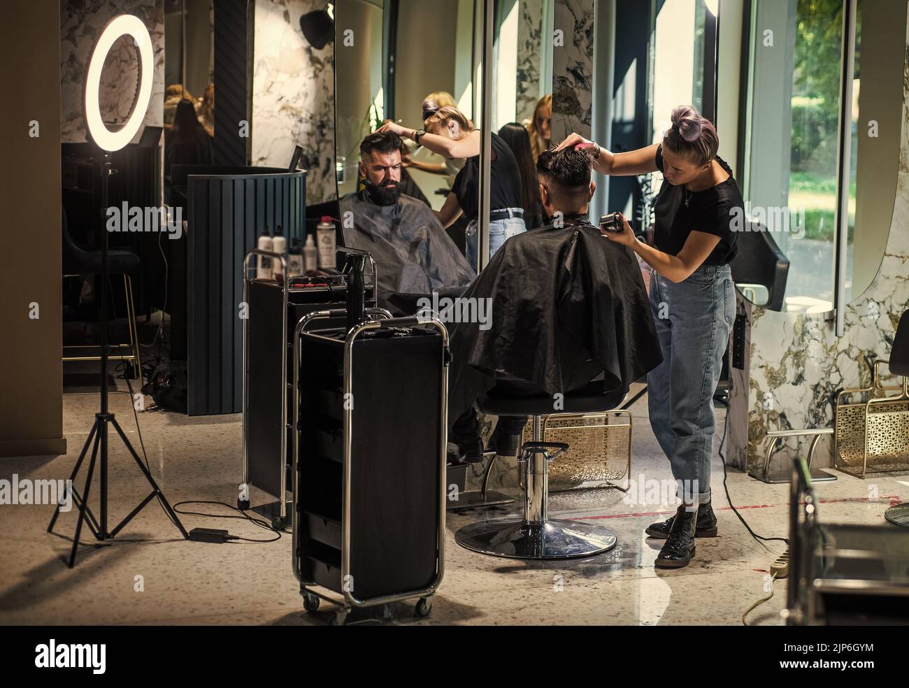 Morning routine. brutal hipster with moustache making new hairstyle ...