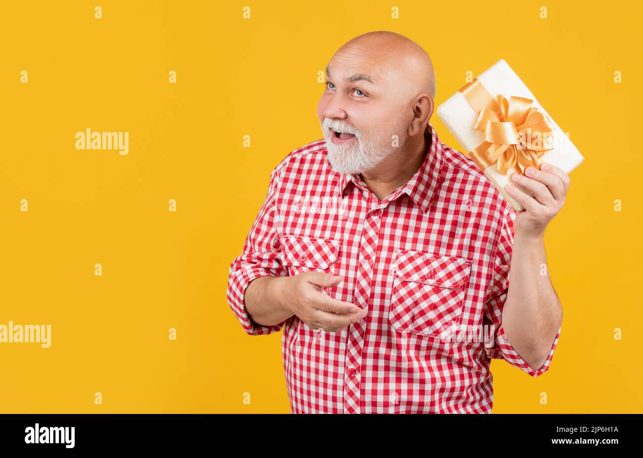 curious old man with present box for retirement Stock Photo - Alamy