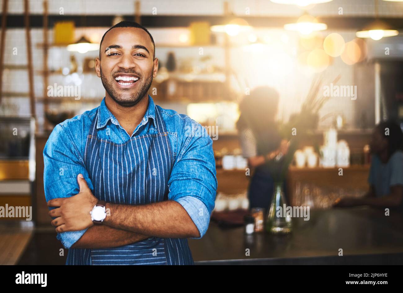 Service with a smile. Cropped portrait of a handsome young man standing ...