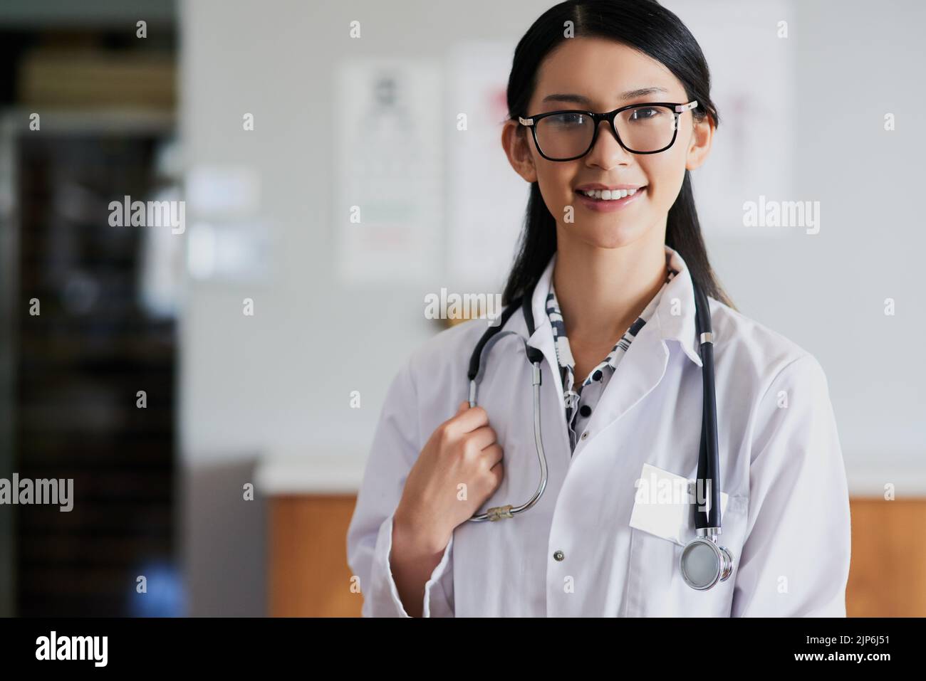 Doctor in hospital office greets hi-res stock photography and images ...