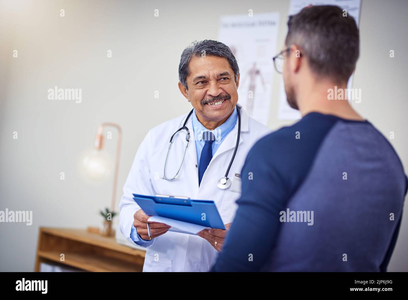 Youll be feeling better in no time. a cheerful mature male doctor ...