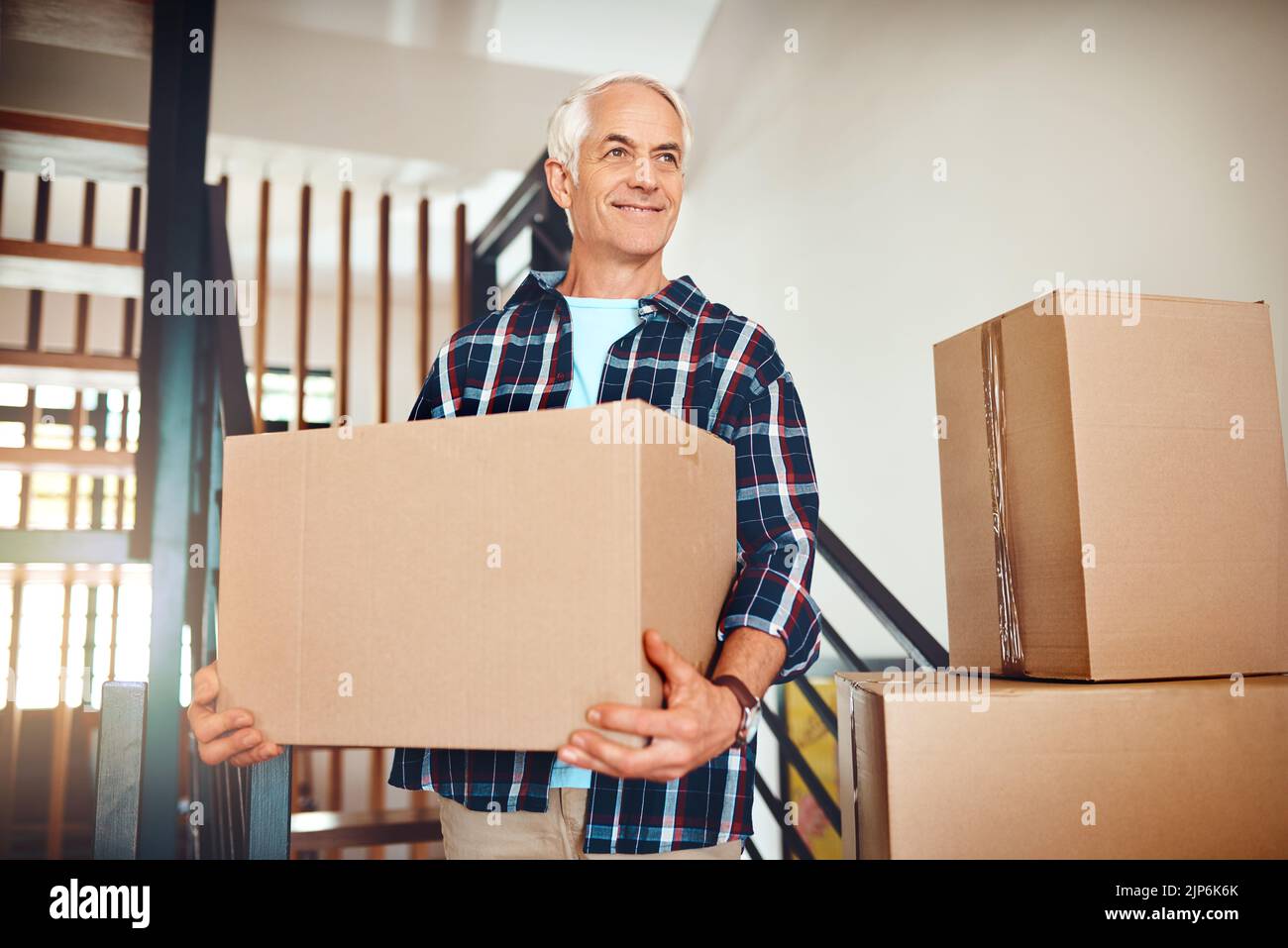 Hard work got him the home of his dreams. a handsome mature man ...