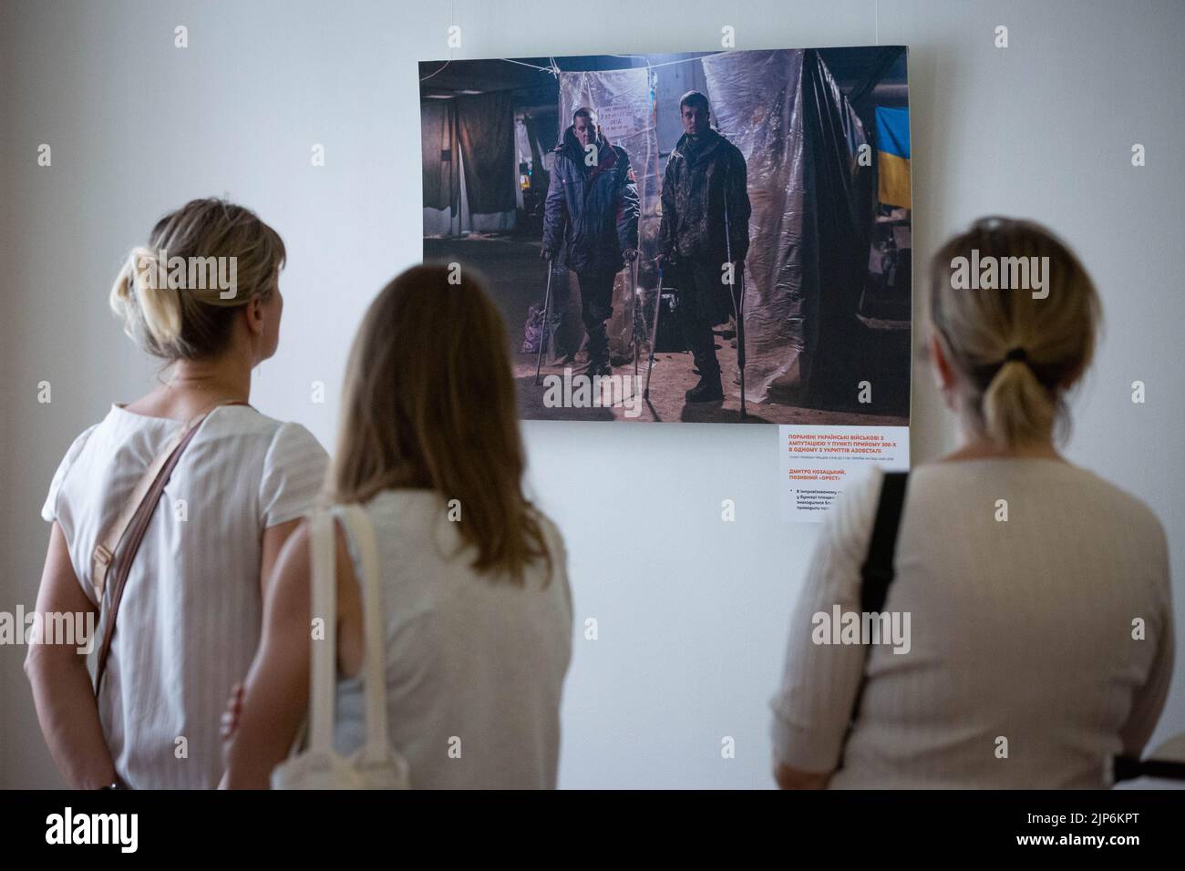 Kyiv, Ukraine. 14th Aug, 2022. People watch pictures by Azov soldier ...