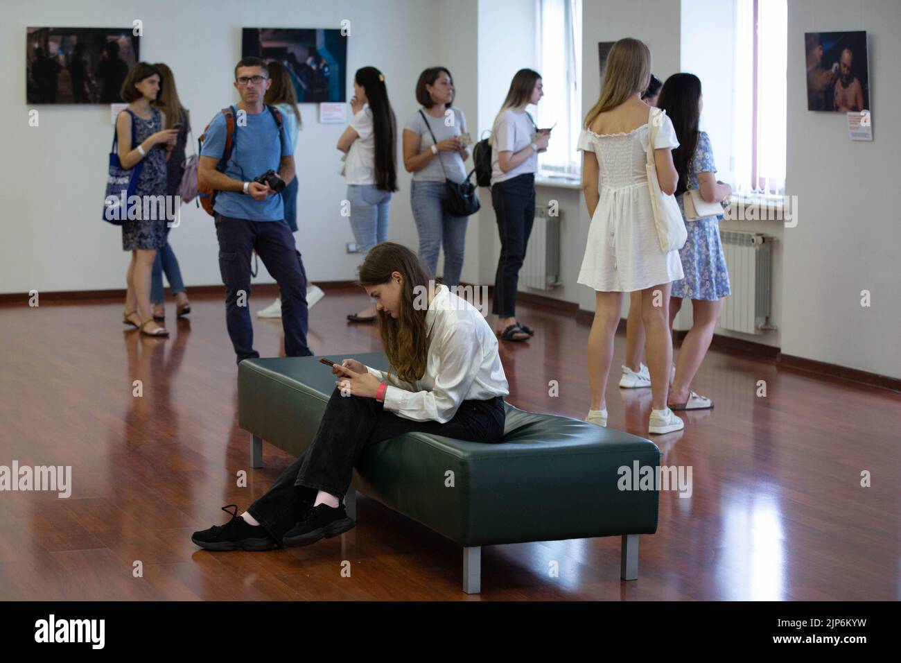 Kyiv, Ukraine. 14th Aug, 2022. People watch pictures by Azov soldier ...