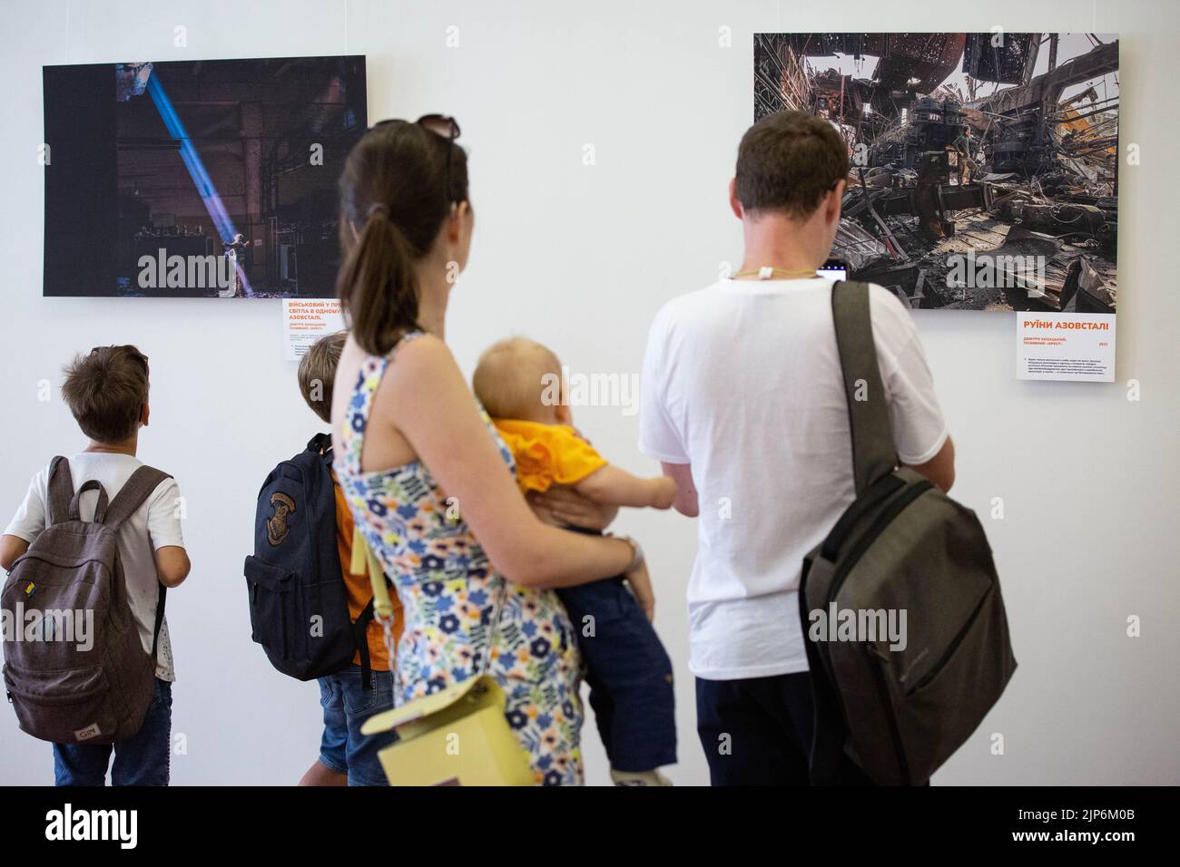Kyiv, Ukraine. 14th Aug, 2022. People watch pictures by Azov soldier ...