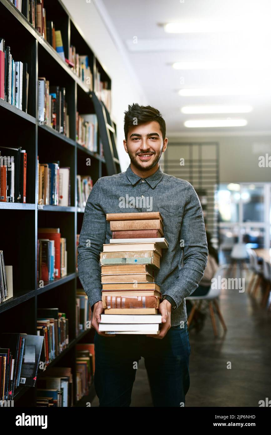 Ready to ace that assignment. Portrait of a happy young man carrying ...
