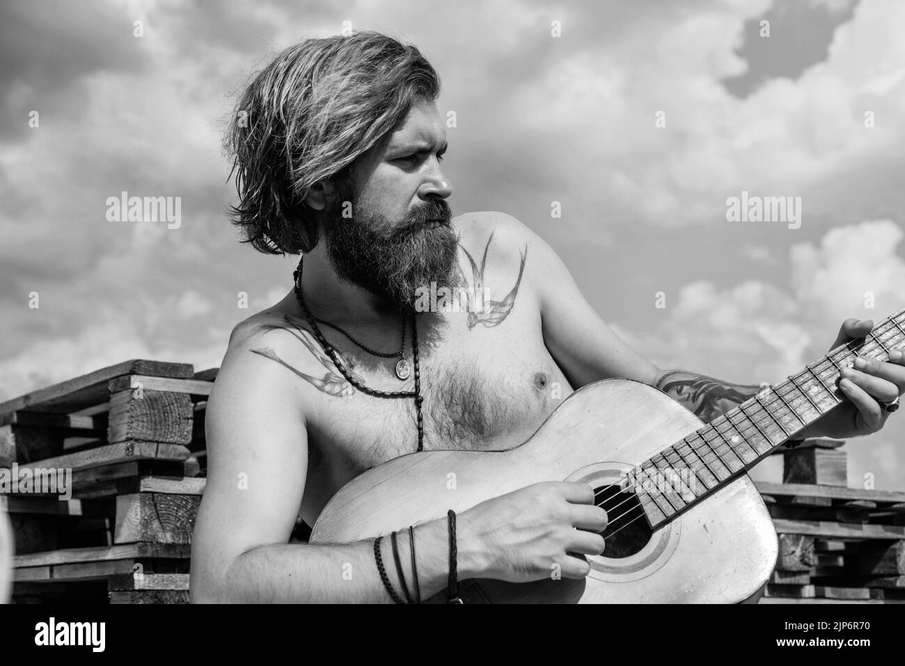 male guitarist with musical instrument. country music concept. bearded ...