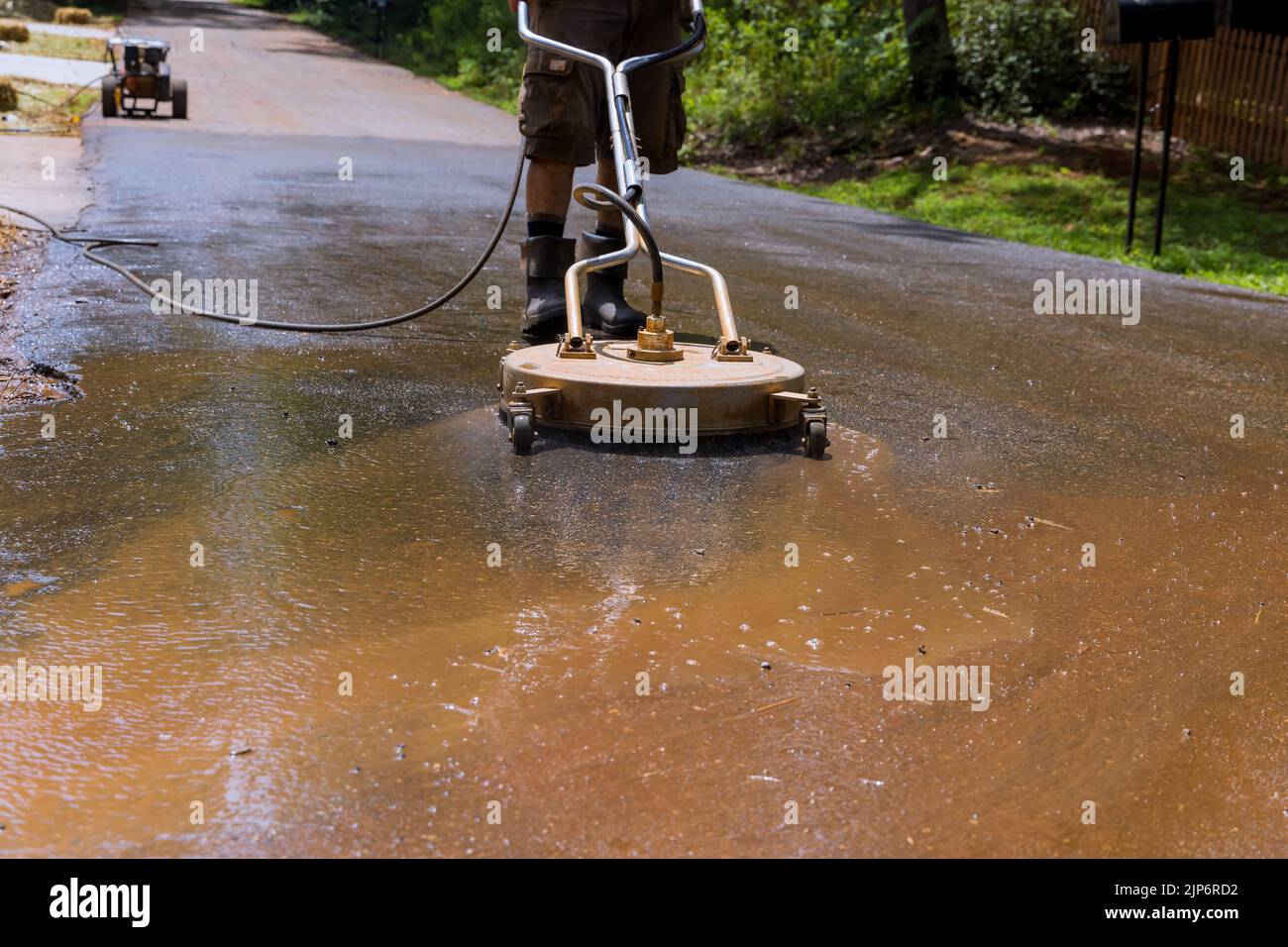 In action is a road flusher that is used for street washing, equipped ...
