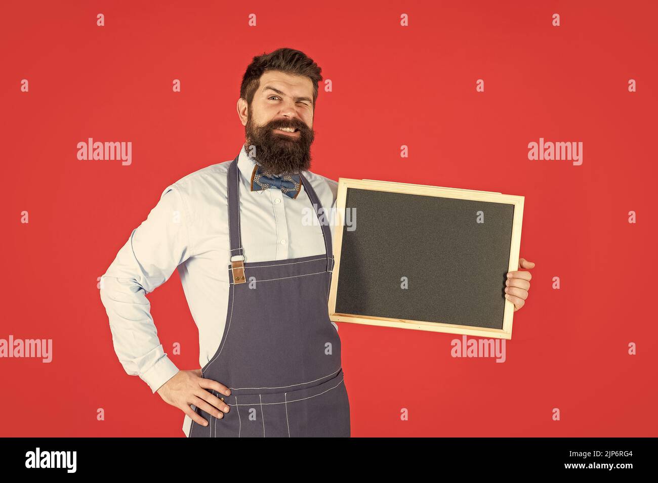 Promotional advertising. Winking man smile holding promo blackboard ...