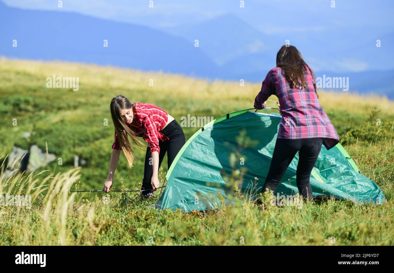 Helpful to have partner for raising tent. Attach necessary structural ...