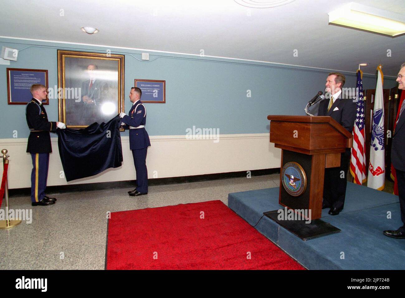 The official portrait of William Cohen is unveiled during a ceremony ...