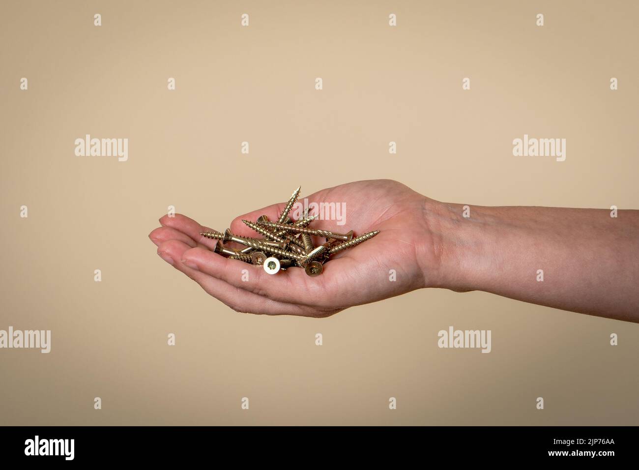 Screws in hand hi-res stock photography and images - Alamy