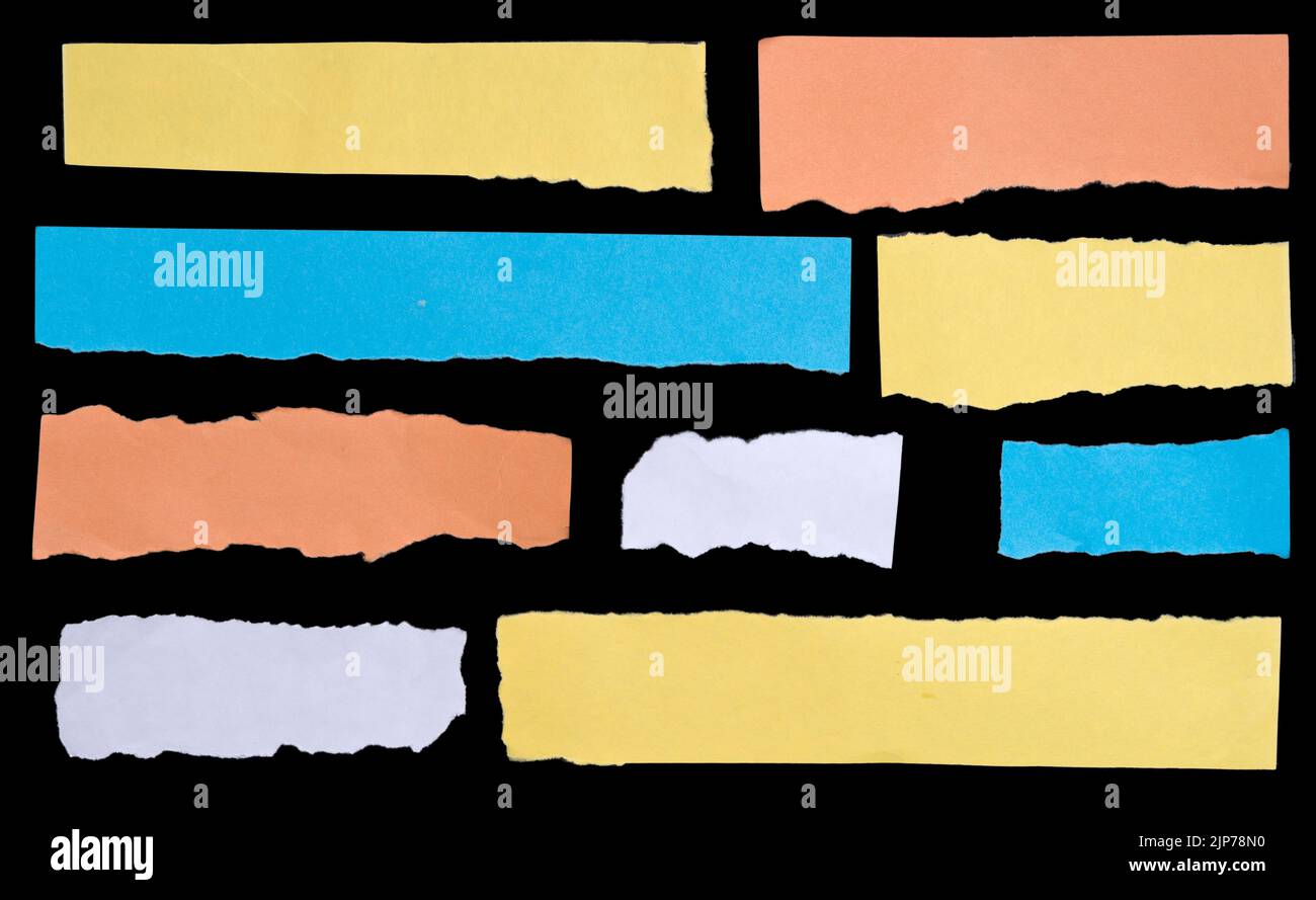 Color torn paper on black background Stock Photo - Alamy