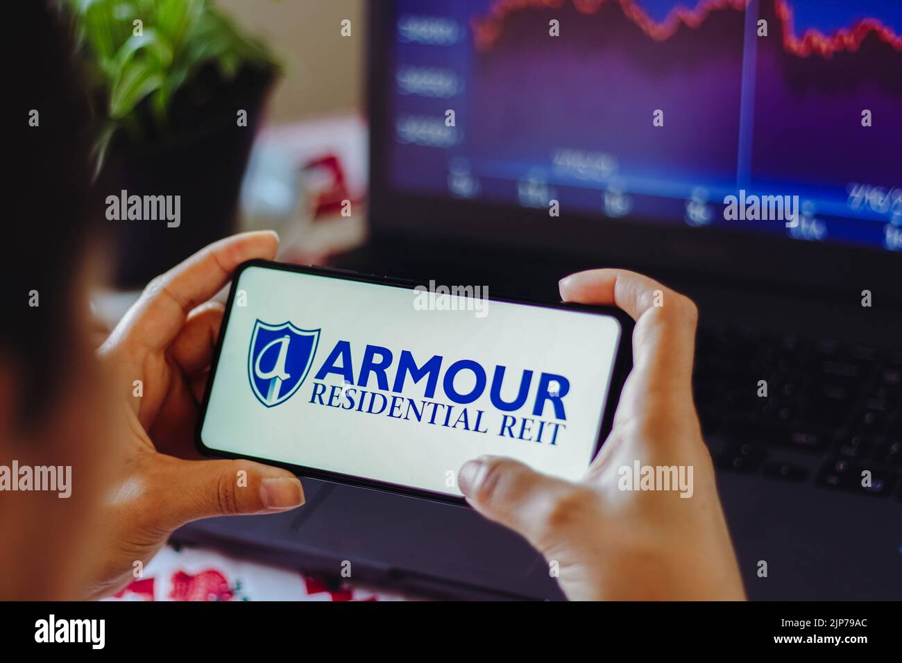 In this photo illustration, the ARMOUR Residential REIT logo is ...