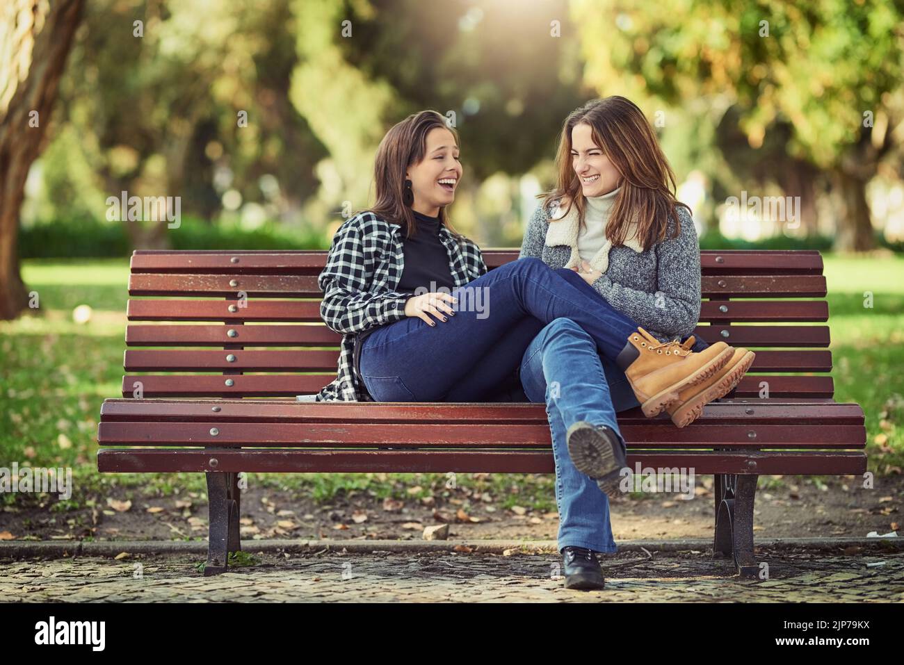 The perfect spot to chill. Full length shot of two attractive young ...
