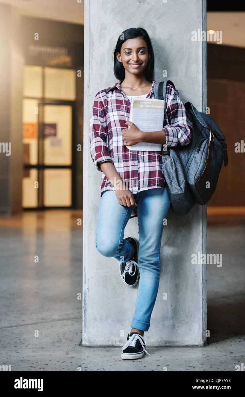 Waiting for the bell to go. Full length portrait of an attractive young ...